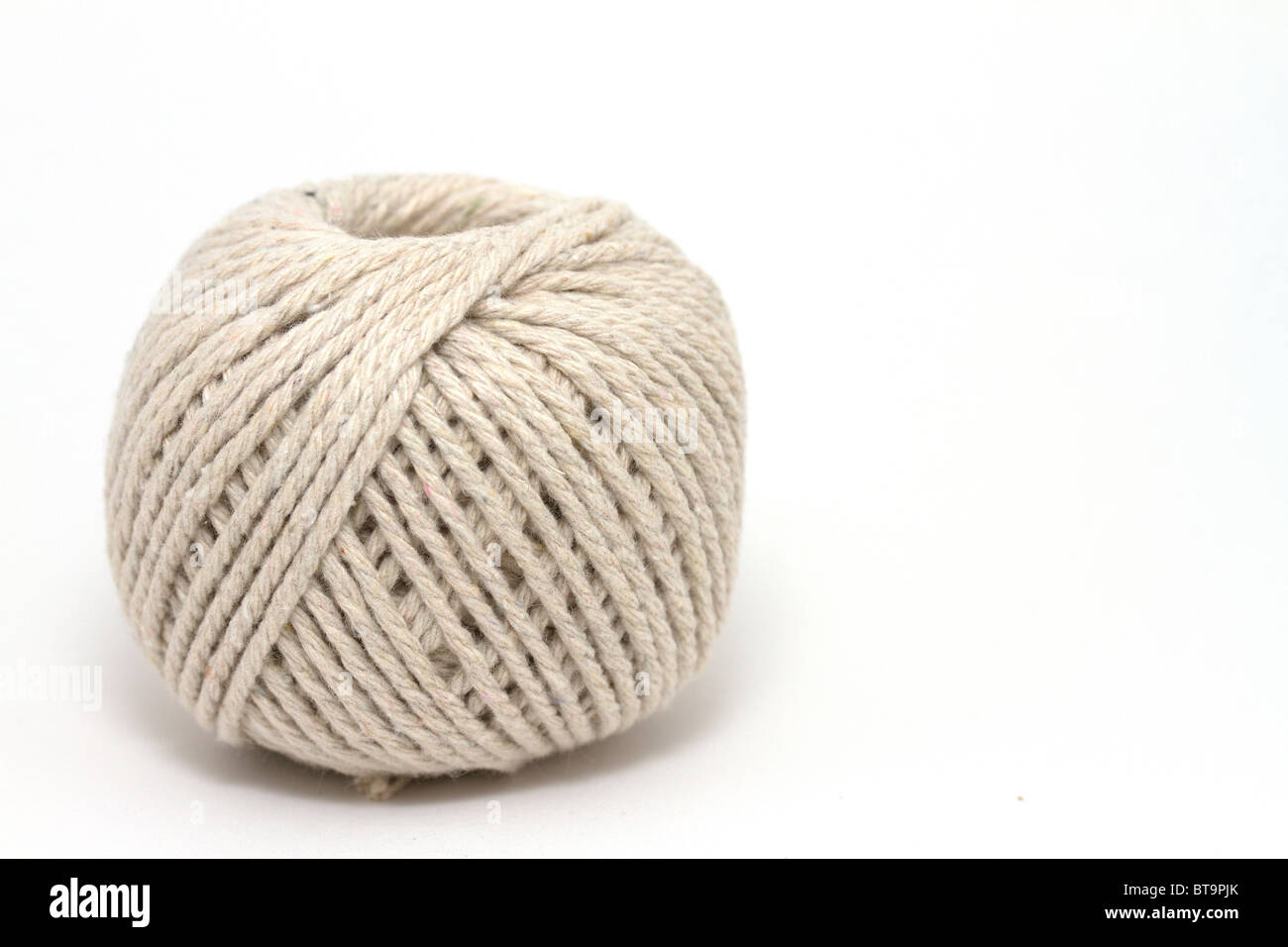 Ball of string on white background Stock Photo - Alamy