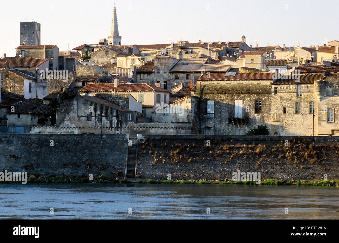 Medieval buildings on the banks of the Rhone River, Arles, Bouches-du ...