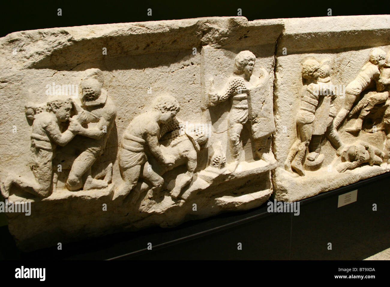 Turkish stone relief of gladiators fighting Stock Photo - Alamy