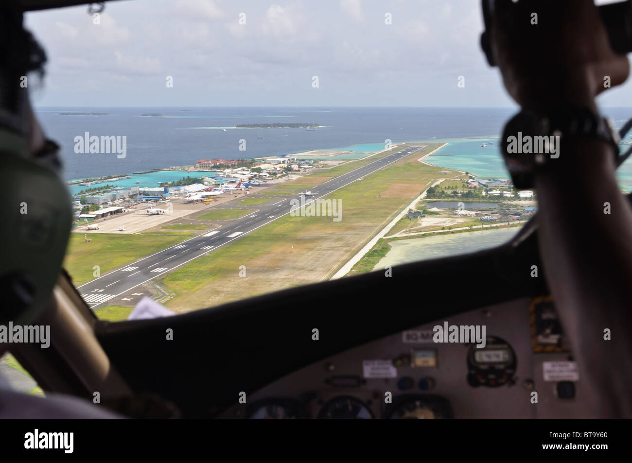 Aircraft cockpit. View on Male airport and takeoff airplane Stock Photo ...