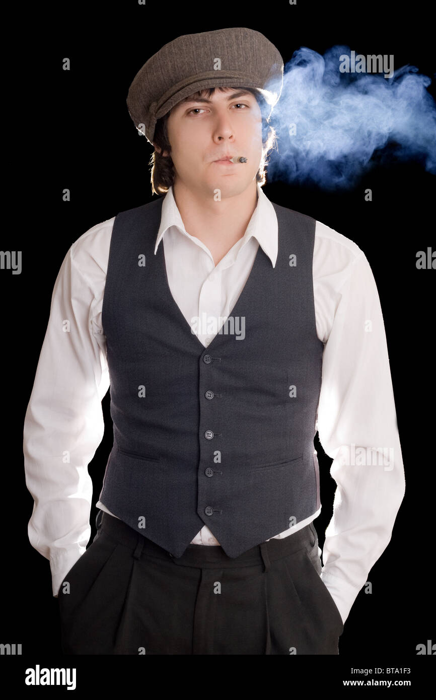 Young man smoking cigarette Stock Photo - Alamy