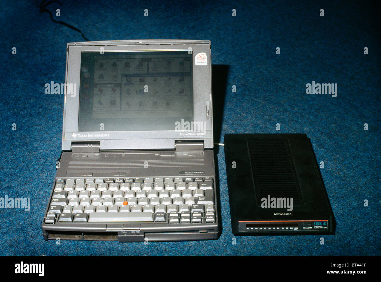 Laptop Computer With Modem Attached Stock Photo - Alamy