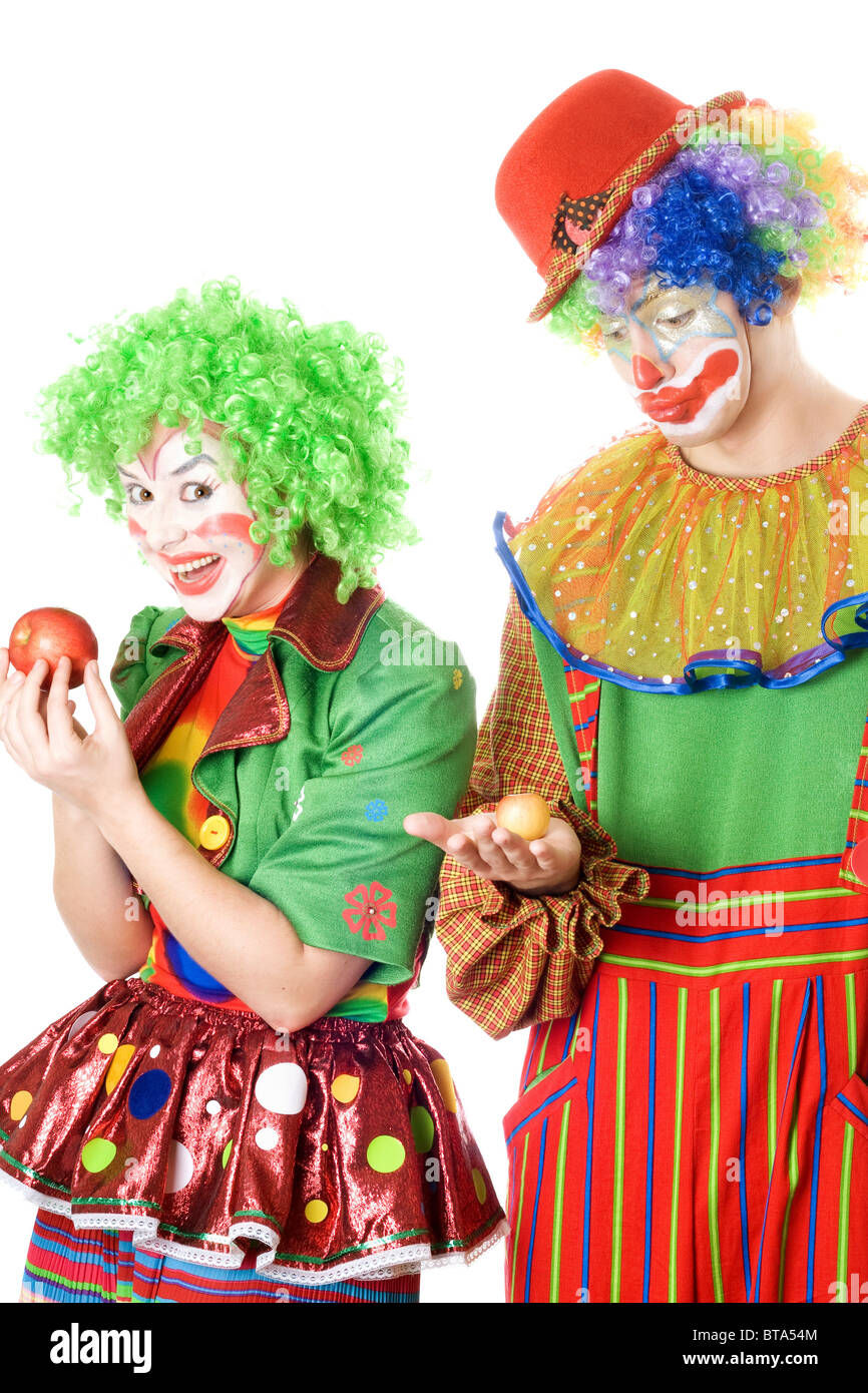 Female clown punching clown. Isolated on white Stock Photo - Alamy