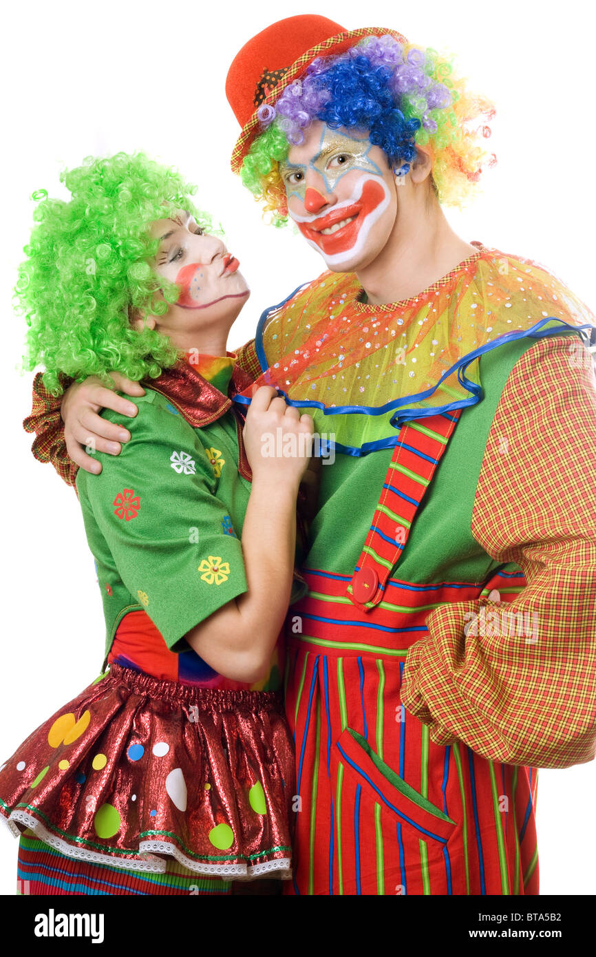 Female clown punching clown. Isolated on white Stock Photo - Alamy