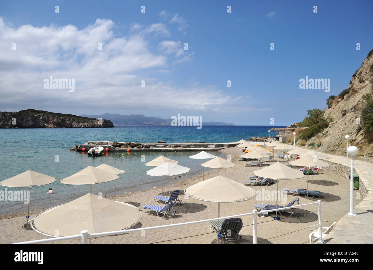 The small harbour and sandy beach at Istria Bay, northern Crete, Greece ...