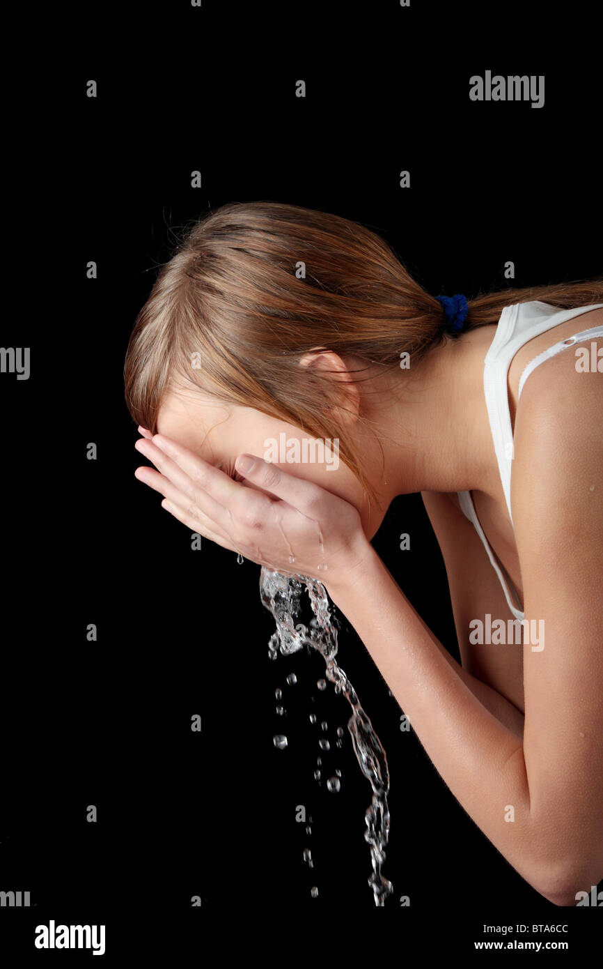 Teen girl washing face hi-res stock photography and images - Alamy