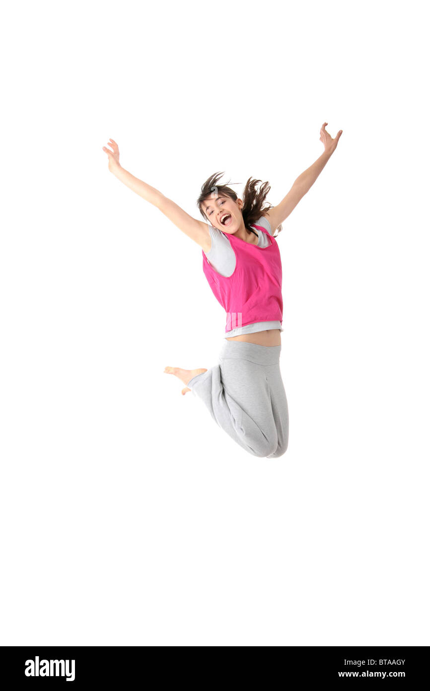 Dancing woman in pink and happy smiling facial expression jumping up ...