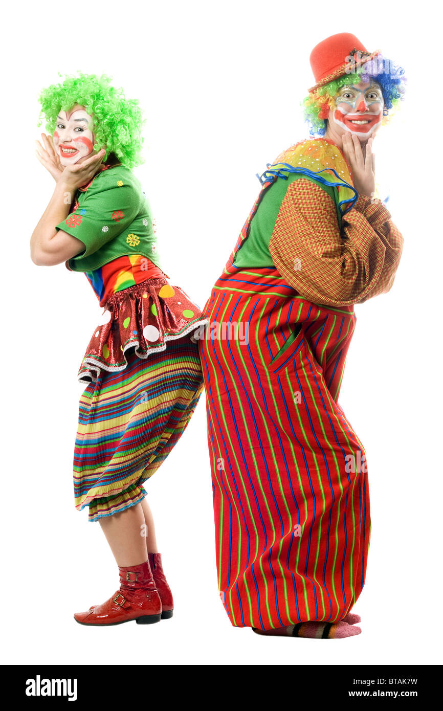 Two smiling clowns are back to back. Isolated Stock Photo - Alamy