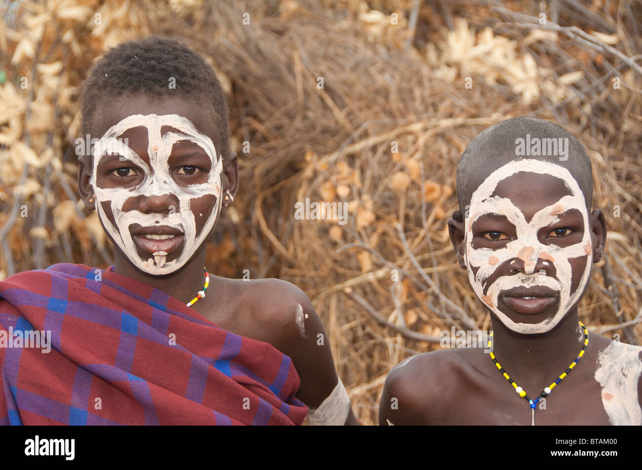 Two Nyangatom (Bumi) boys with their face painted, Omo river Valley ...