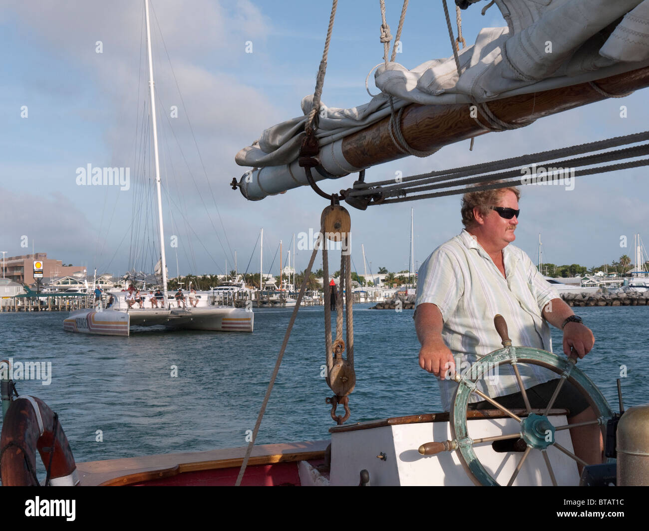 Helmsman steering the Sailing Ship the Schooner Appledore off Key West ...