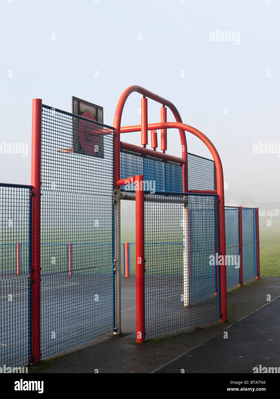 Park hard play area with goal and basketball net Stock Photo - Alamy