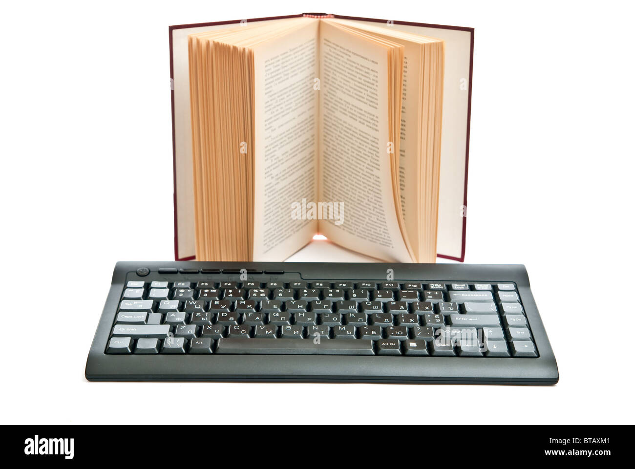 Keyboard and book Stock Photo - Alamy