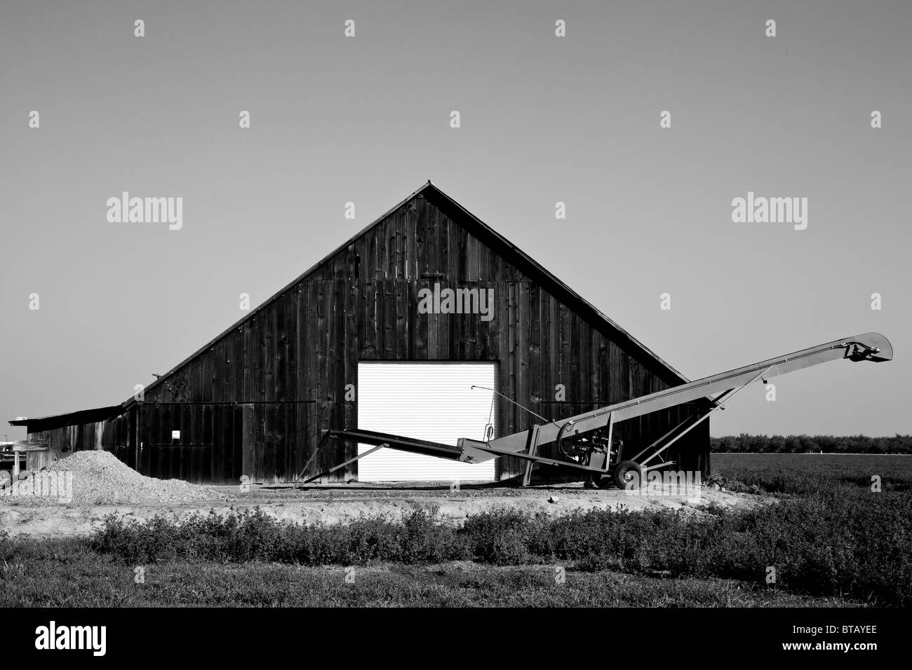 Farming equipment in front Black and White Stock Photos & Images - Alamy