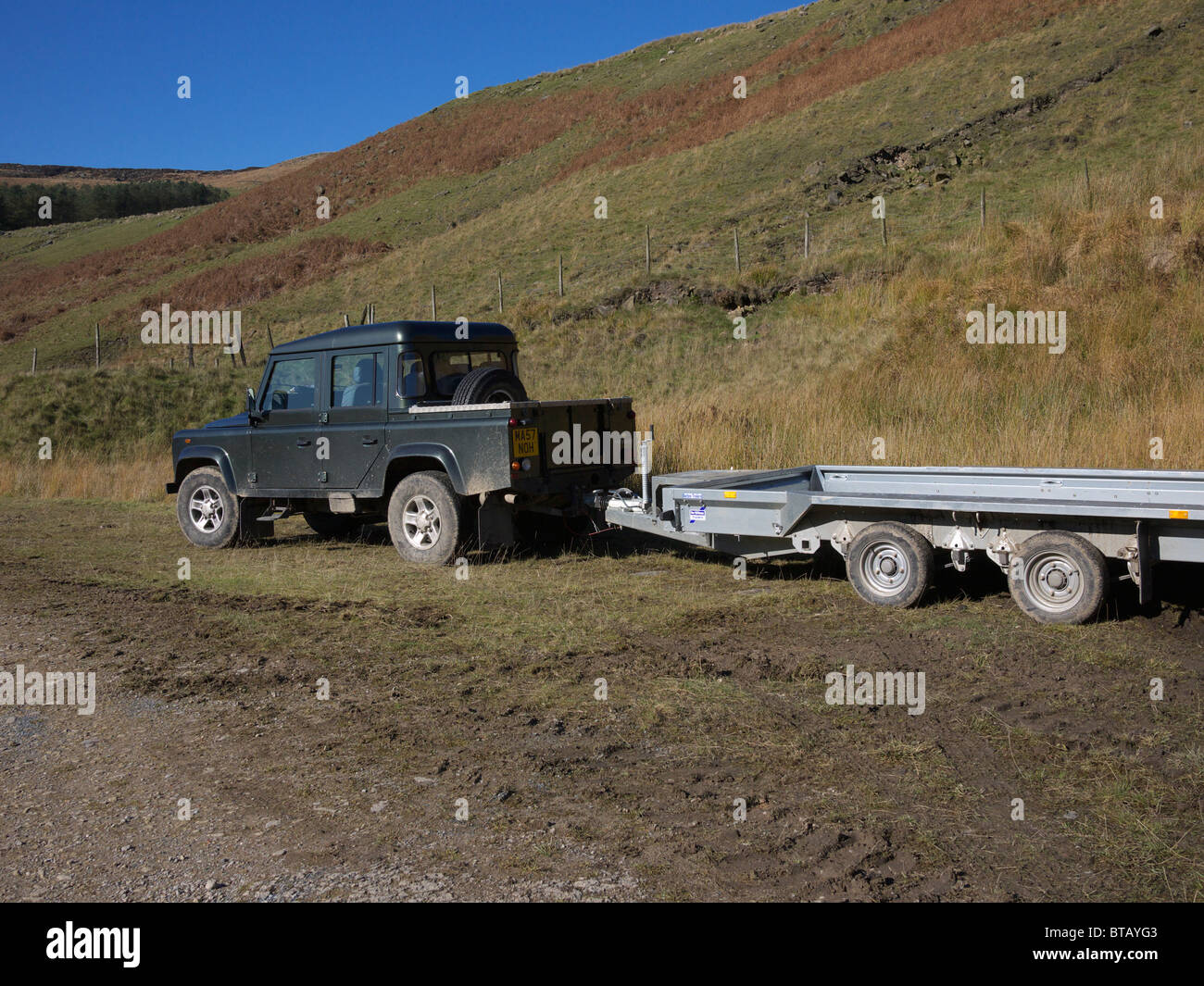Land Rover with long trailer on moorland, Saddleworth, England, UK ...