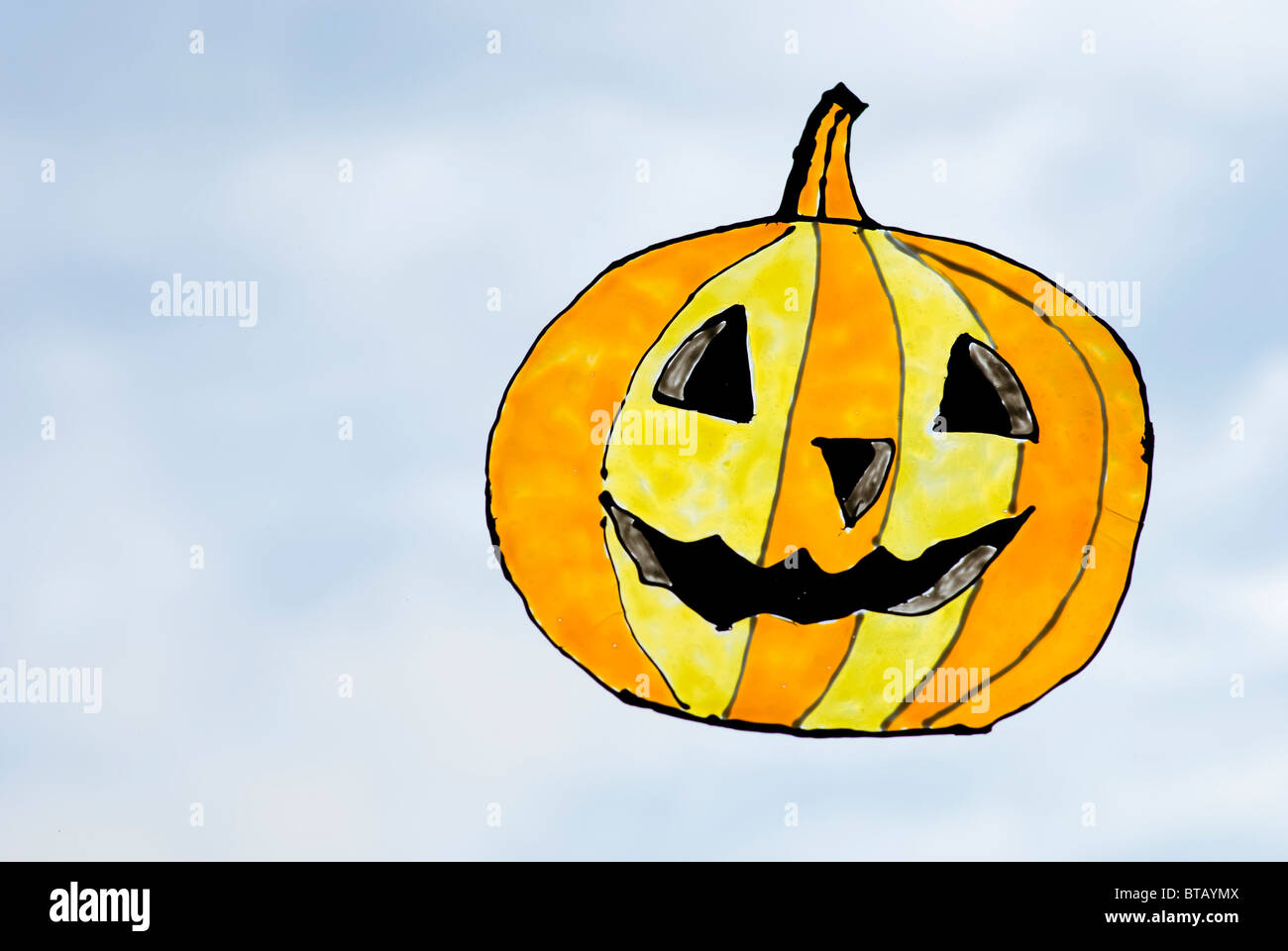 Pumpkin painted on the window Stock Photo - Alamy