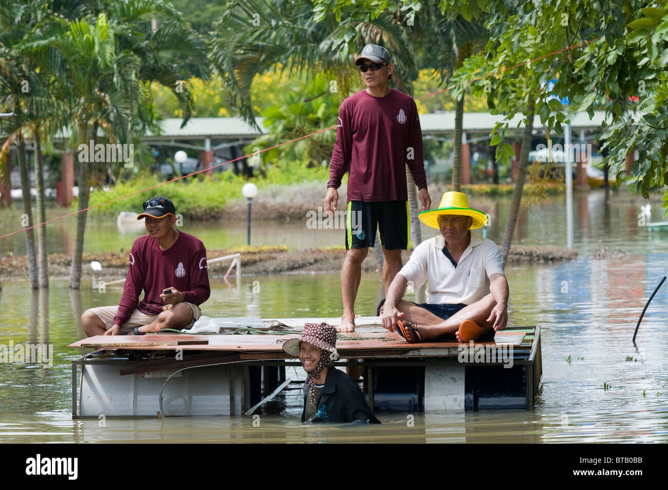 Members of the police force on an improvised raft during the October ...