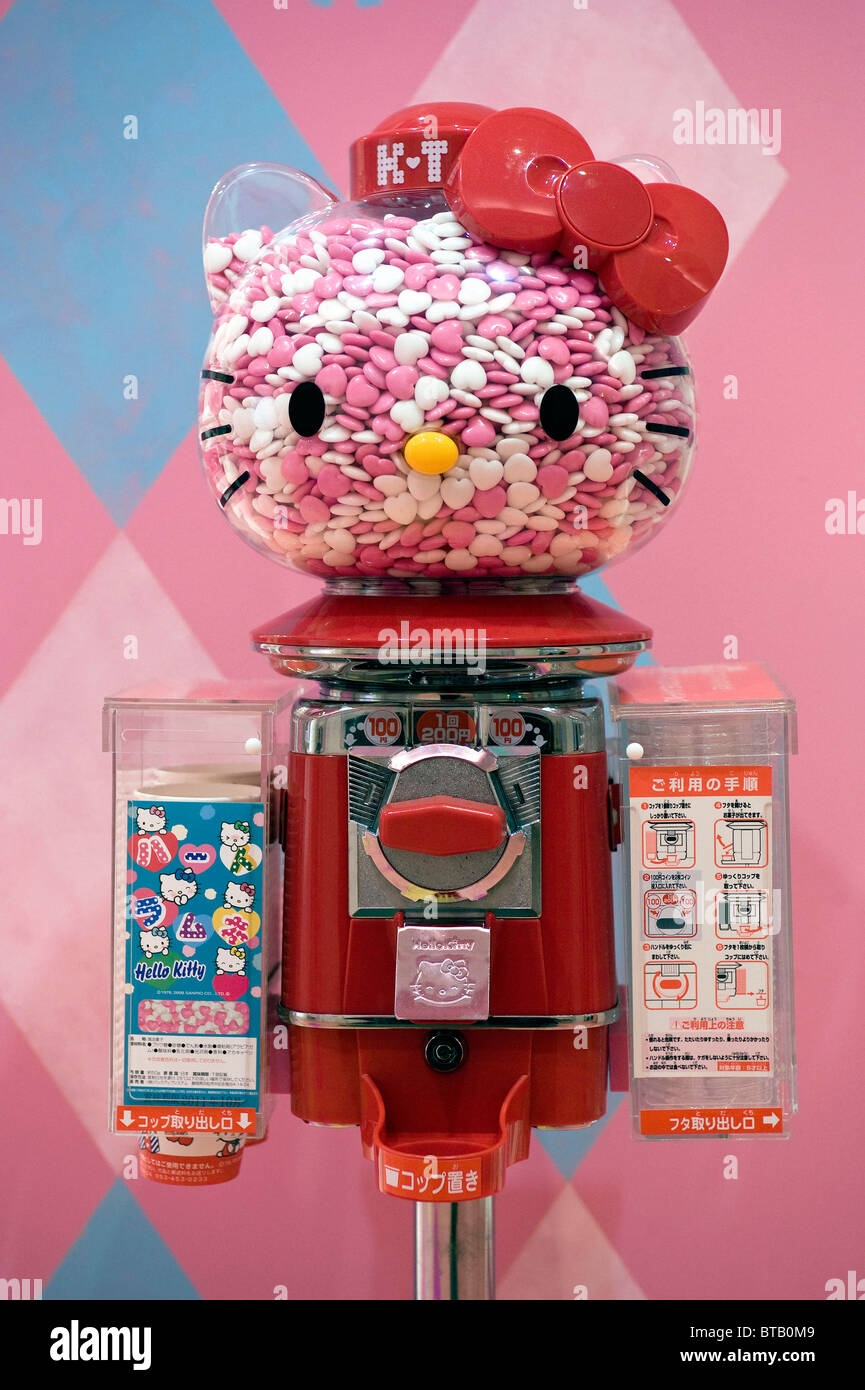 A Hello Kitty dispensing machine selling heart-shaped candy is shown ...
