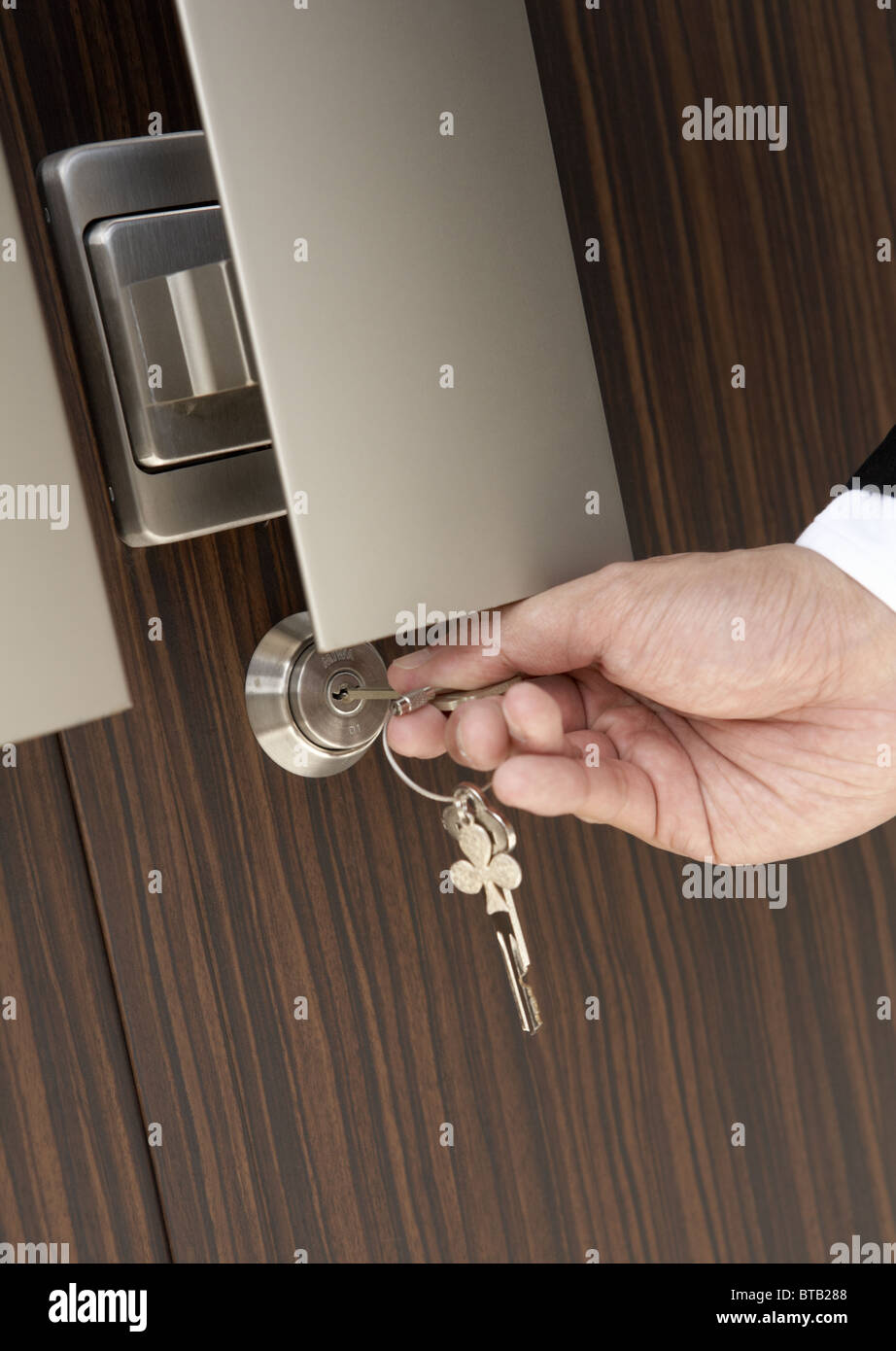 Hand locking door hi-res stock photography and images - Alamy
