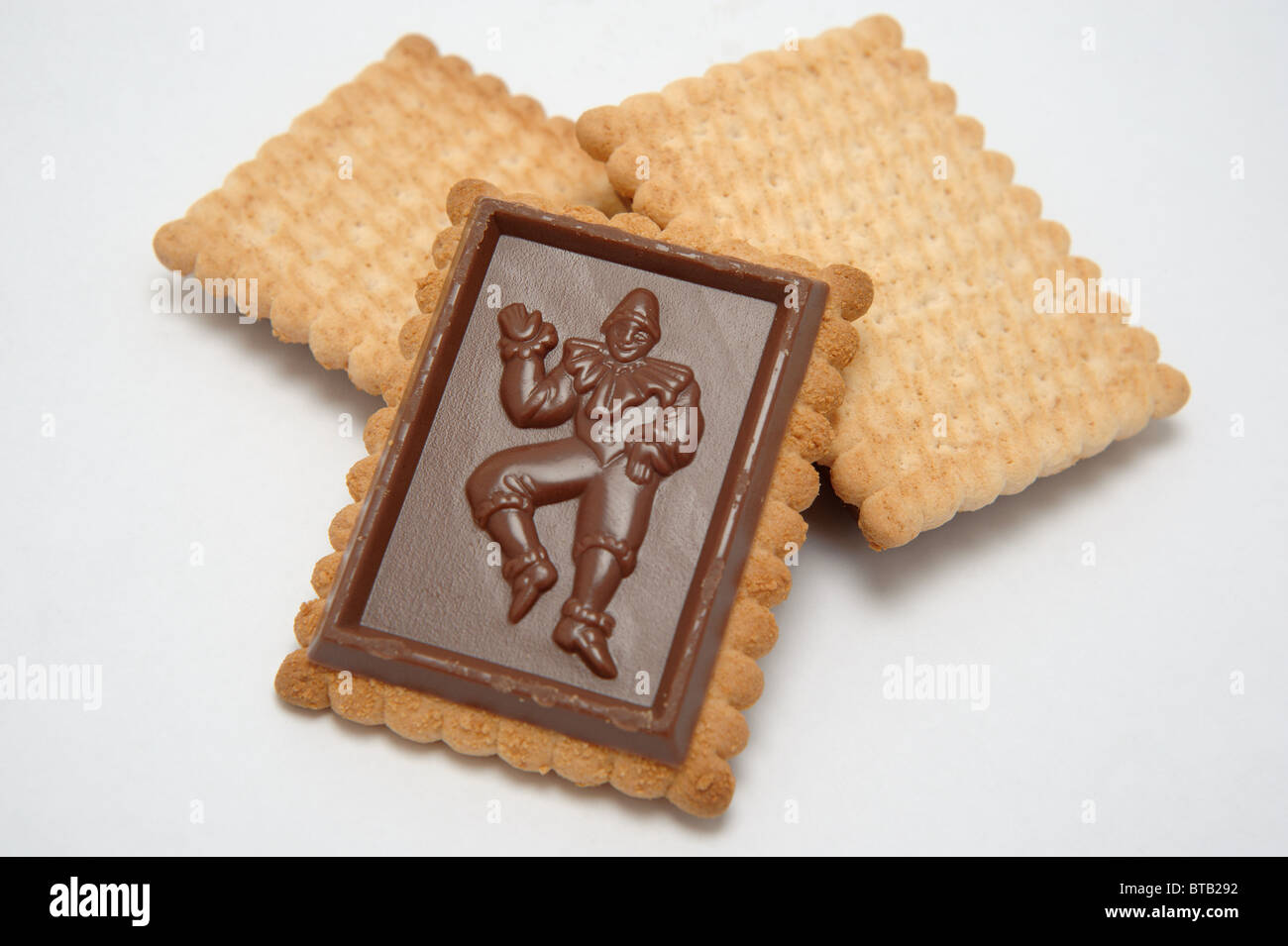 Three chocolate biscuits on white background Stock Photo - Alamy