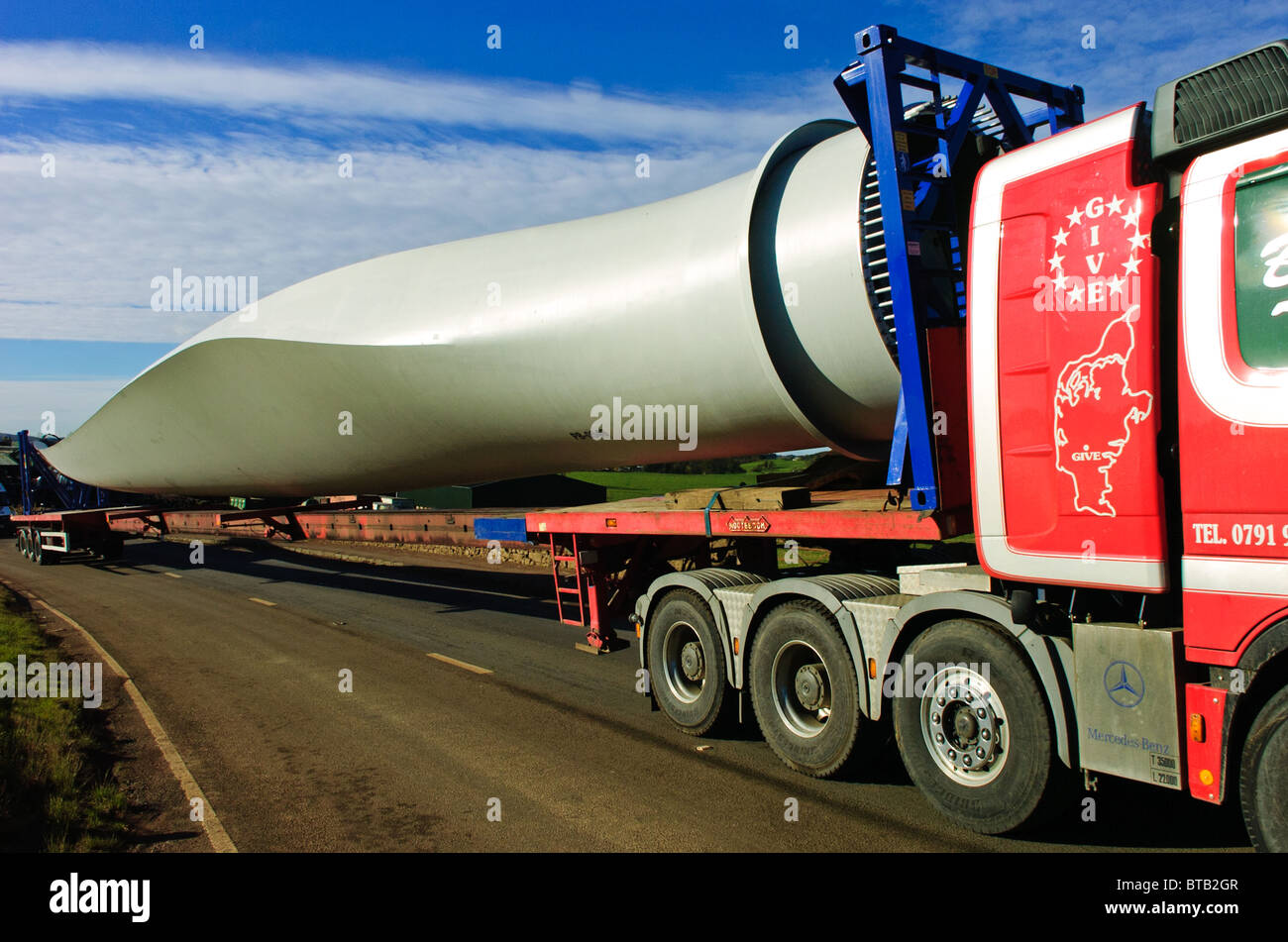 Giant blades for a wind turbine being transported by road in South ...