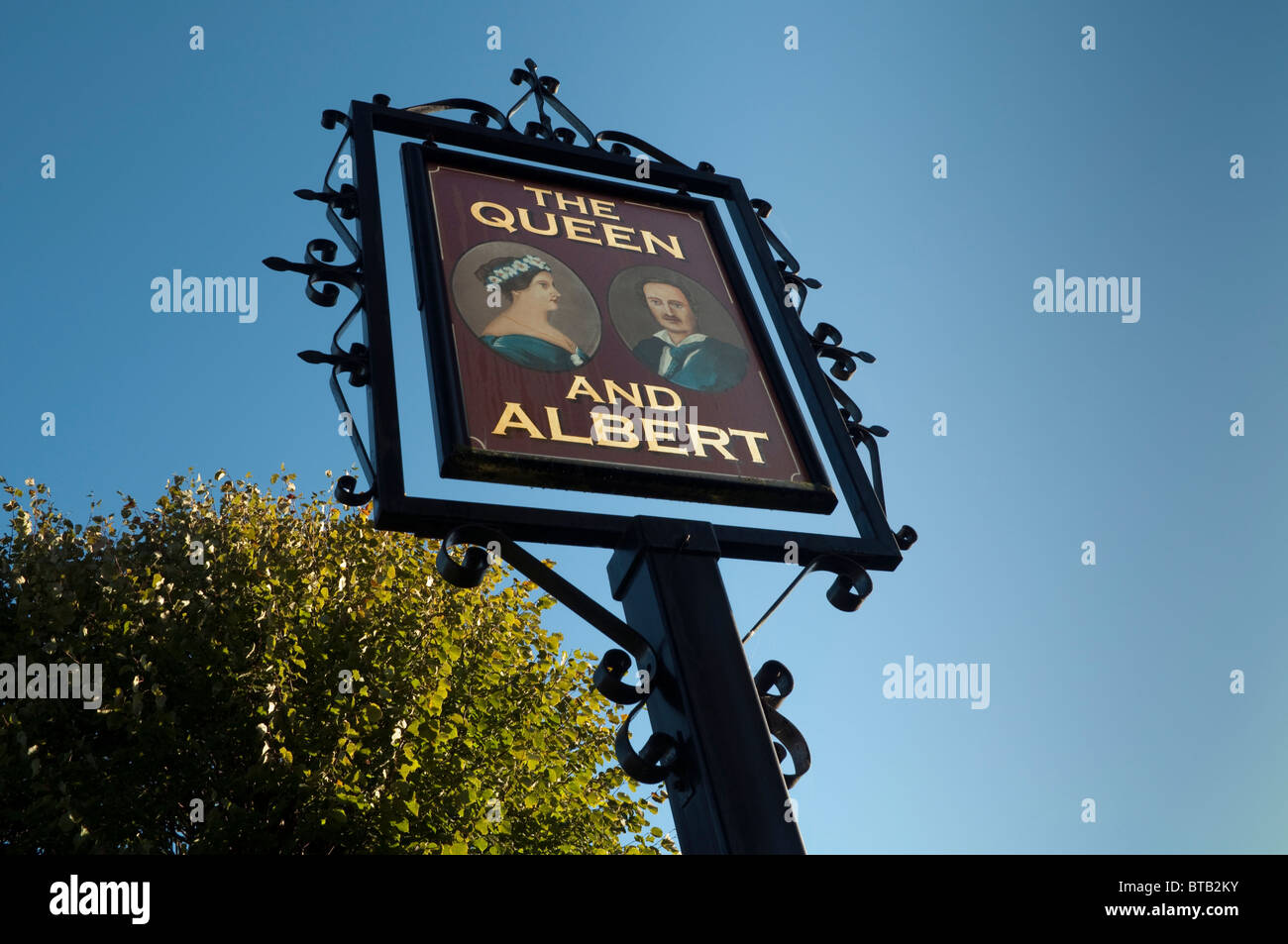 A village pub sign against a clear blue sky in Wooburn Green ...