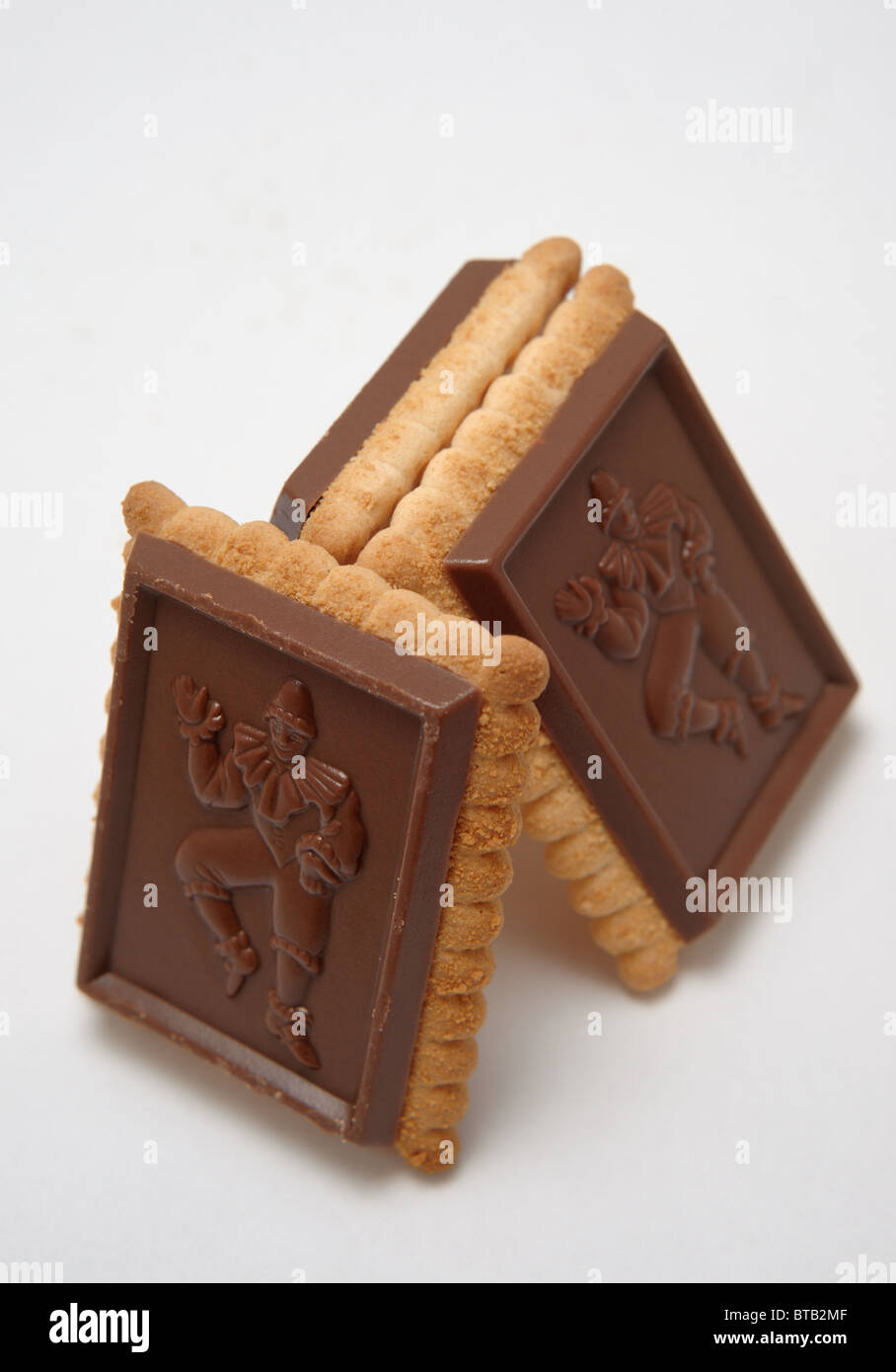 Three chocolate biscuits on white background Stock Photo - Alamy