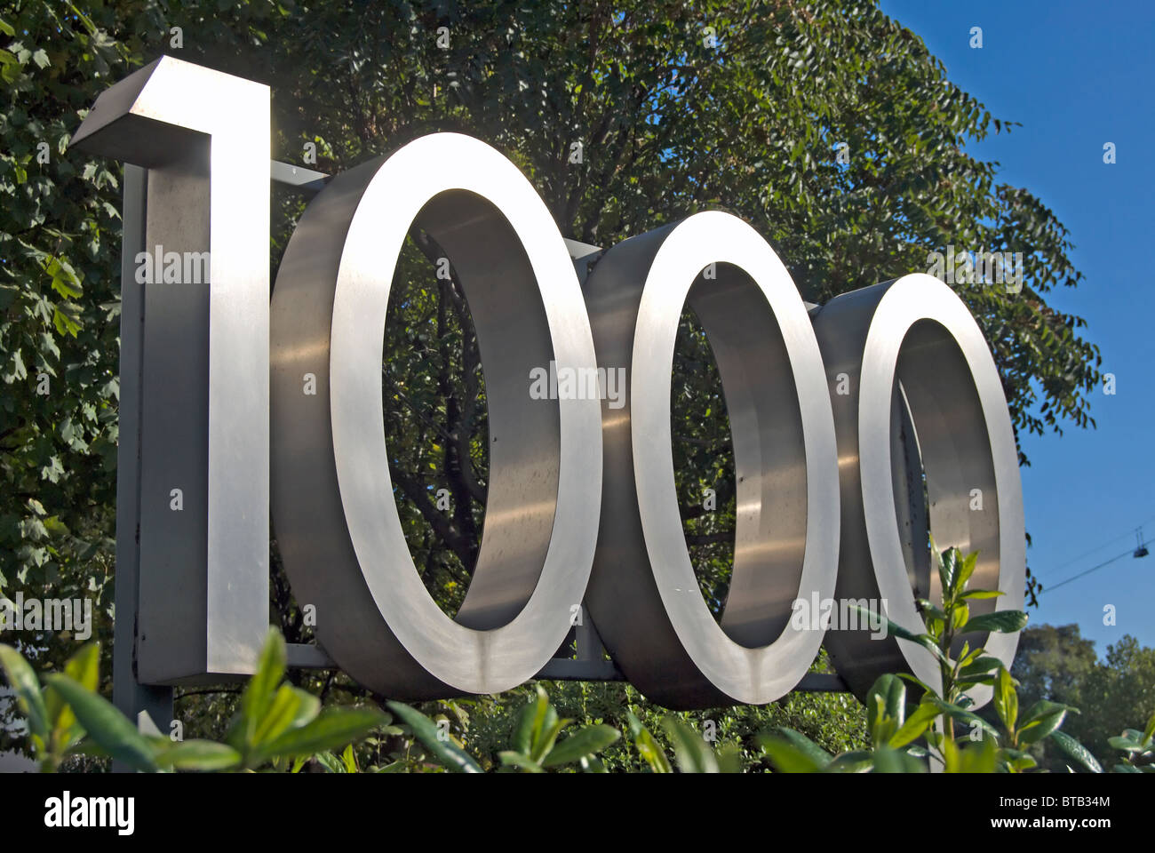 the number one thousand written in numerals to indicate an address on ...