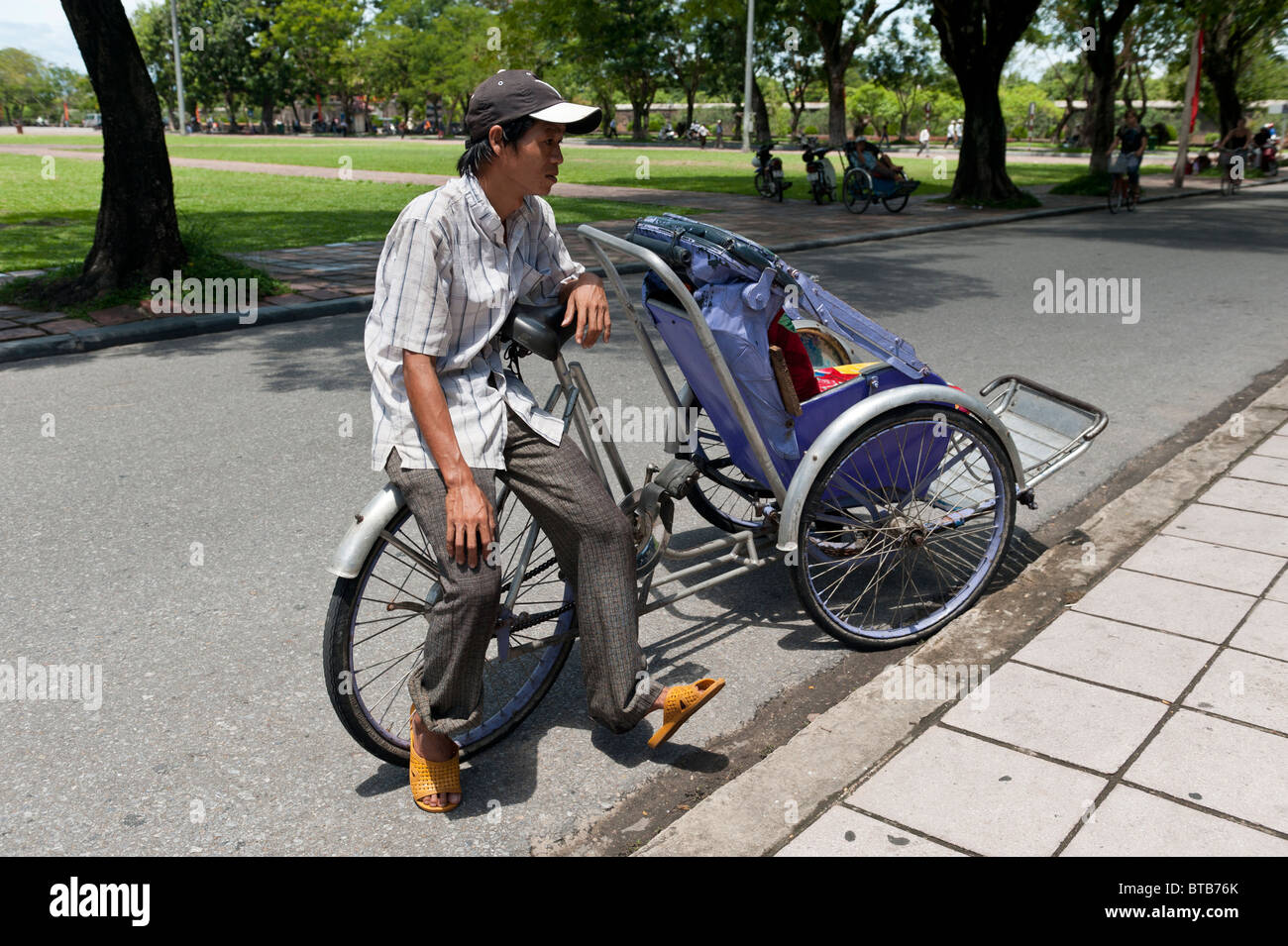 Bicycle Rickshaw Worker Waiting for a Customer near Ngan Gate at the ...