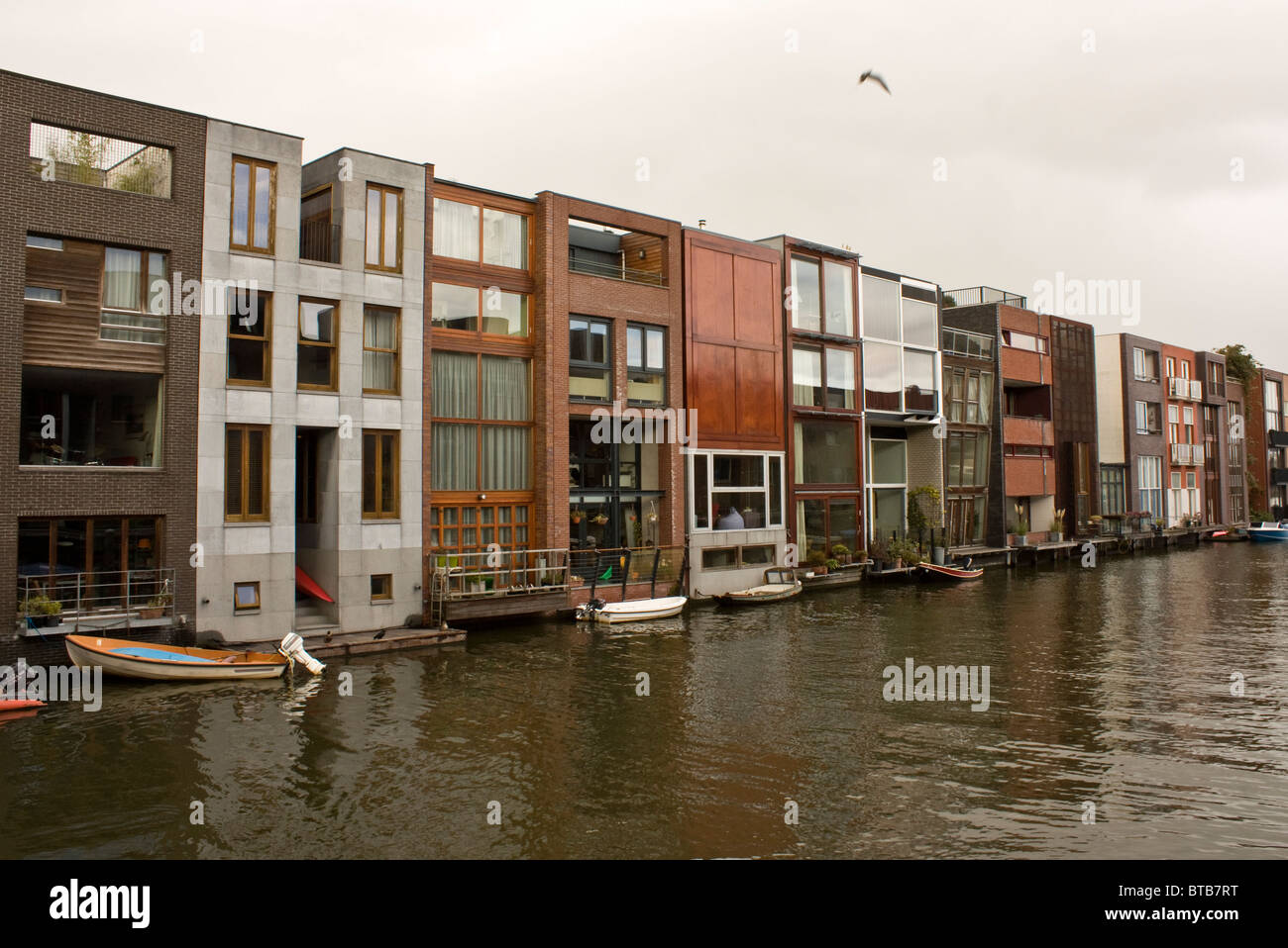 Unique architecture in in Scheepstimmermanstraat, Amsterdam. Row houses ...