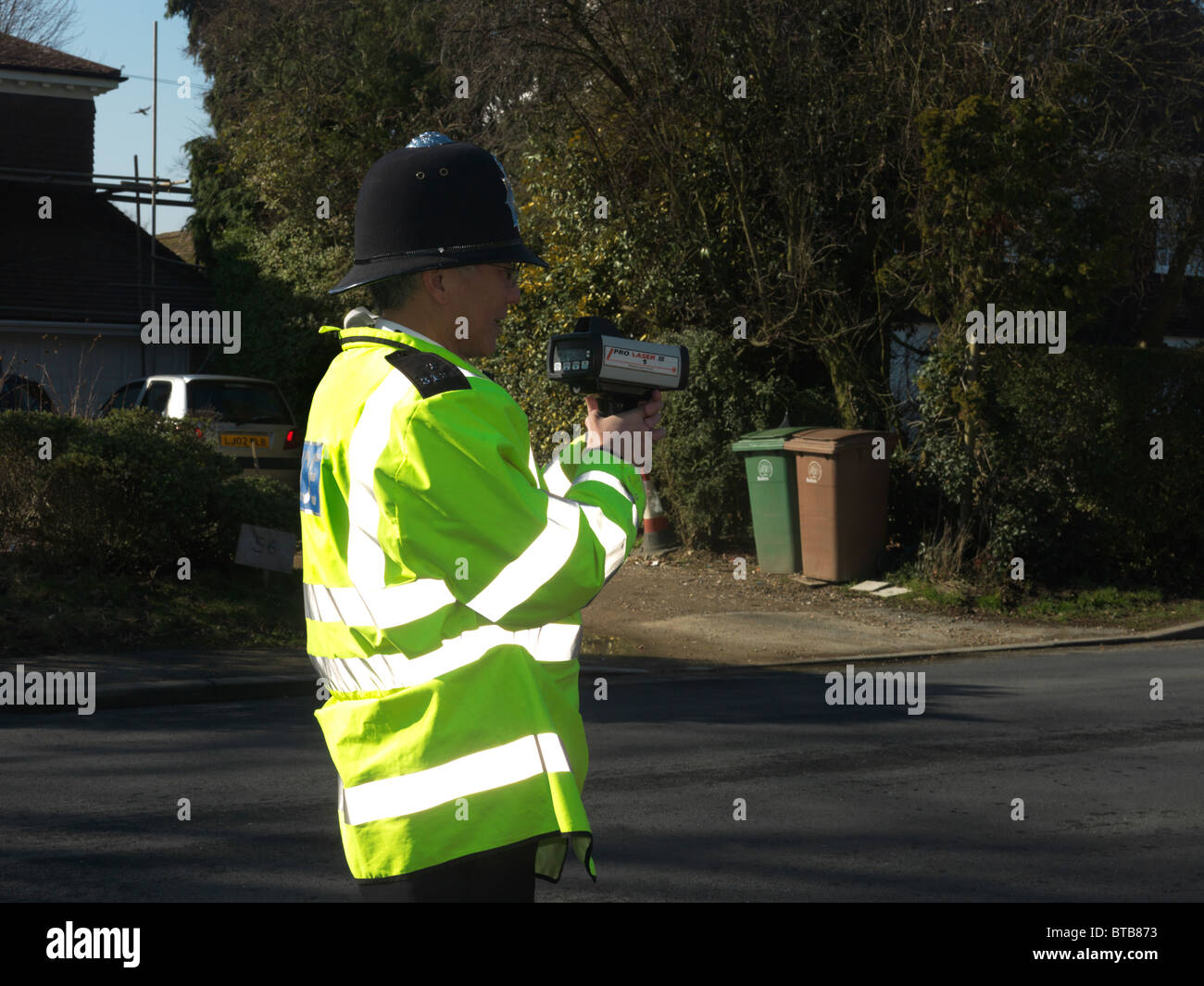 Policeman using speed radar gun hi-res stock photography and images - Alamy