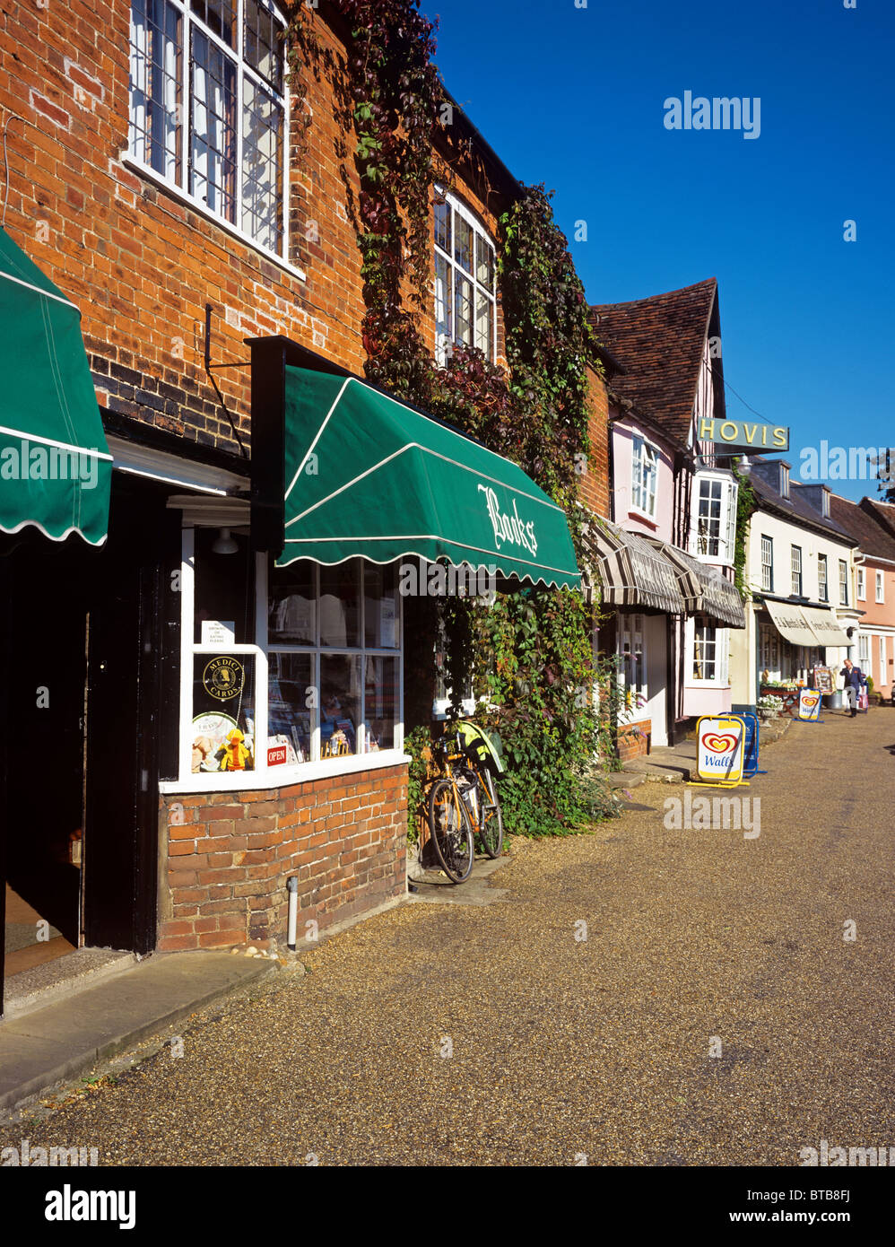 Quaint shops in a square in the picturesque medieval town of Lavenham ...