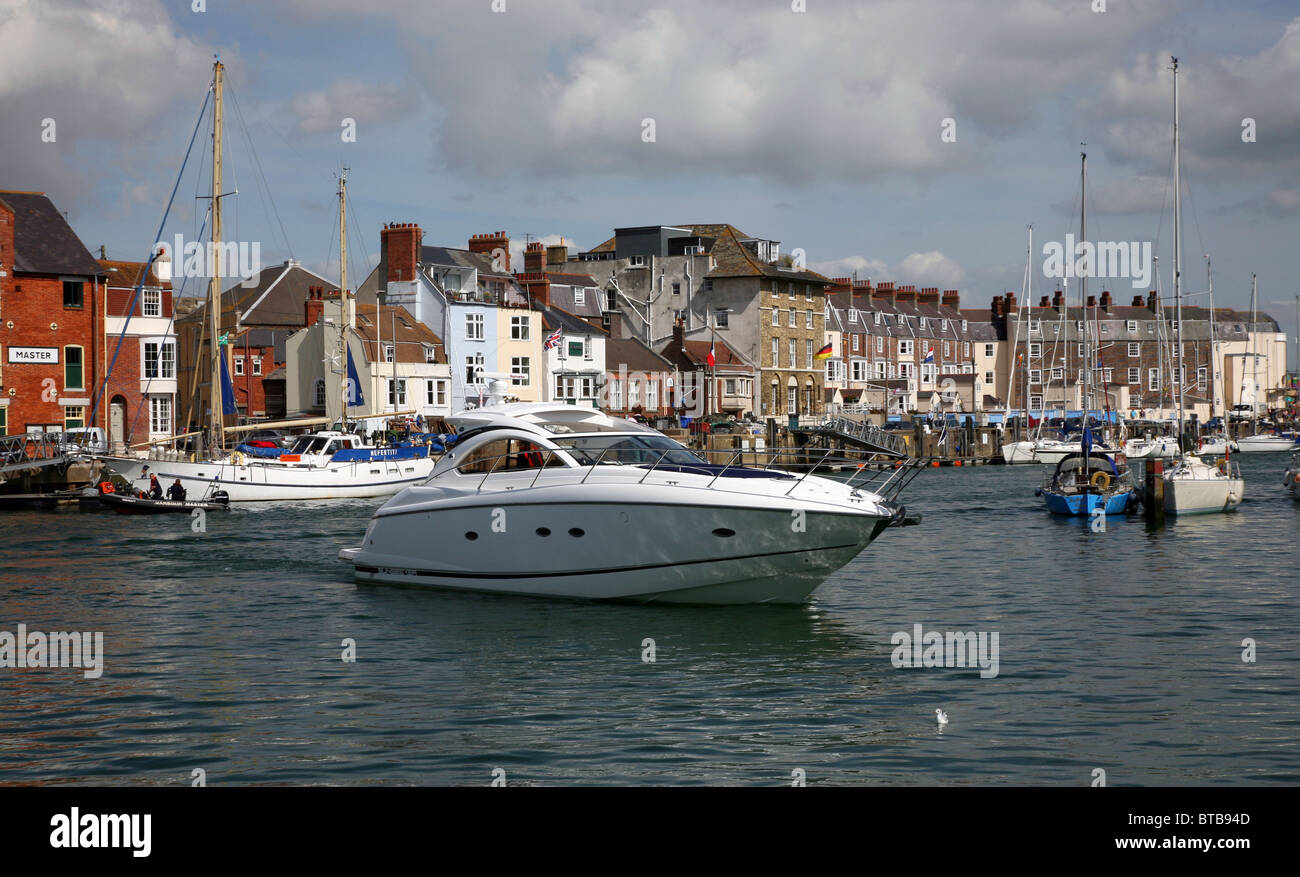 Boating scene in Weymouth harbour, the popular sailing and fishing port ...