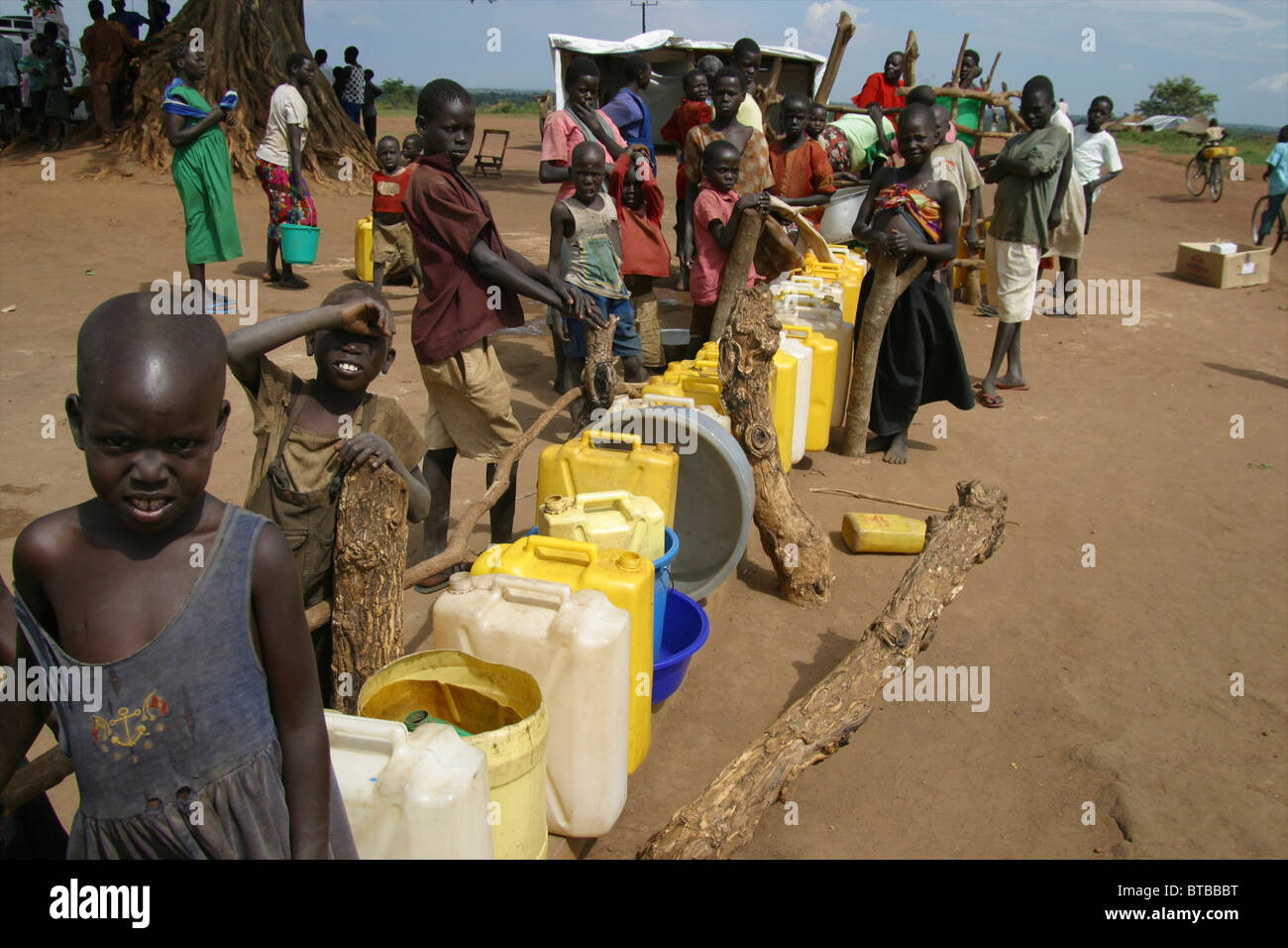 fetching water in uganda Stock Photo - Alamy