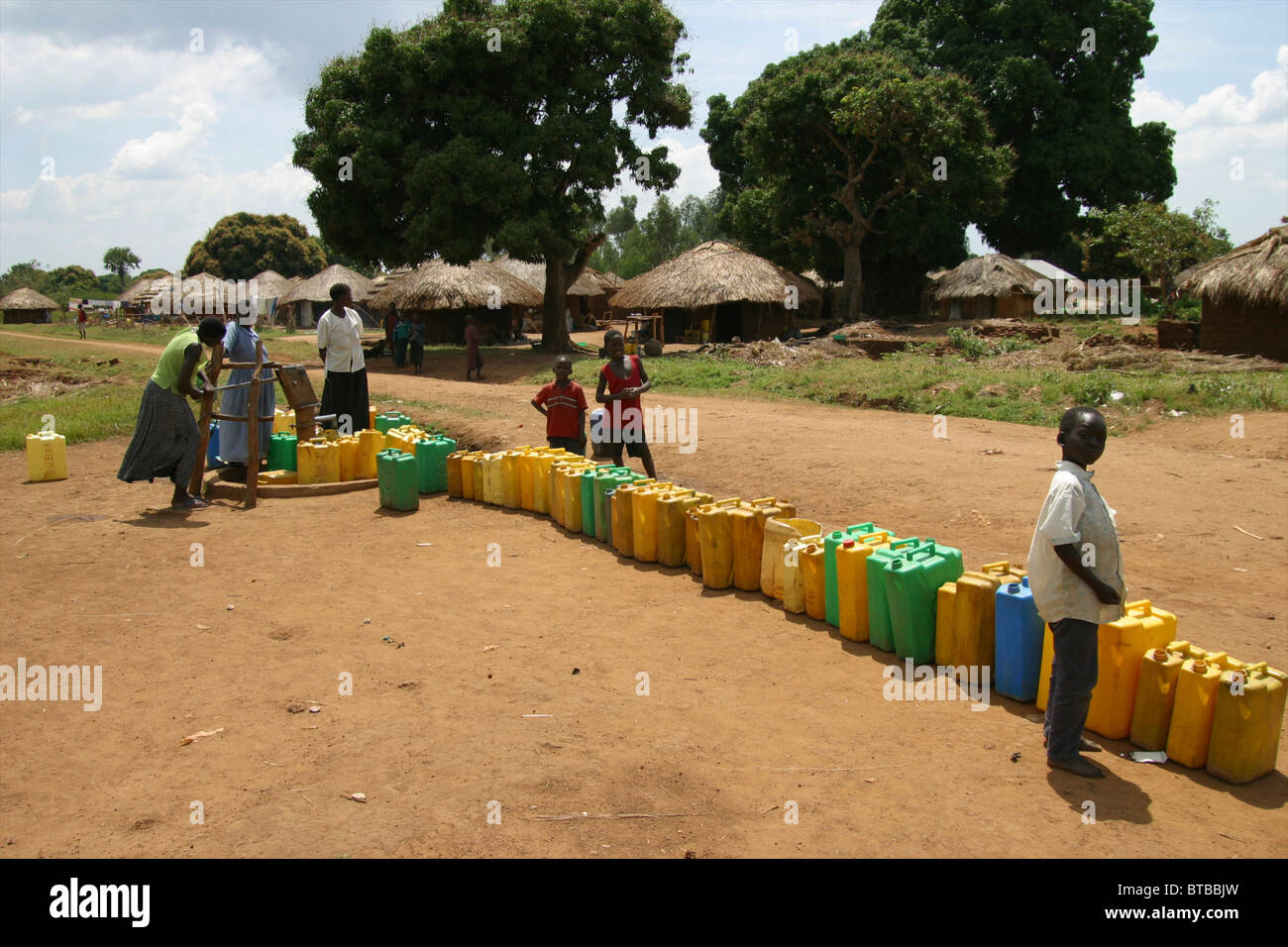 Women by water pump hi-res stock photography and images - Alamy
