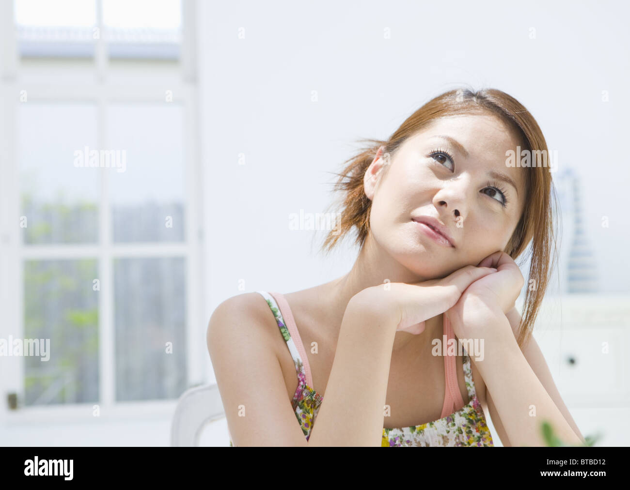 Young woman thinking Stock Photo - Alamy