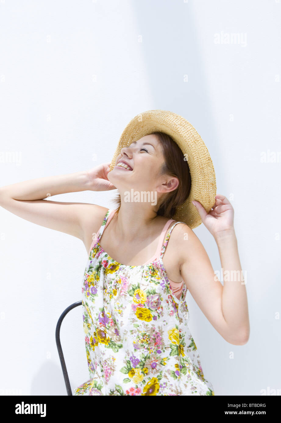 Young woman wearing straw hat Stock Photo - Alamy