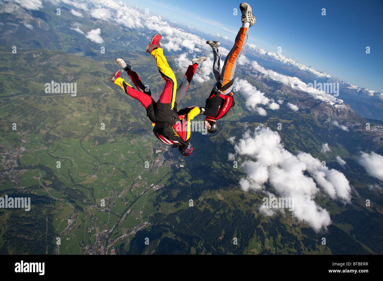 Freefly skydiving team is training the head down formation over a ...
