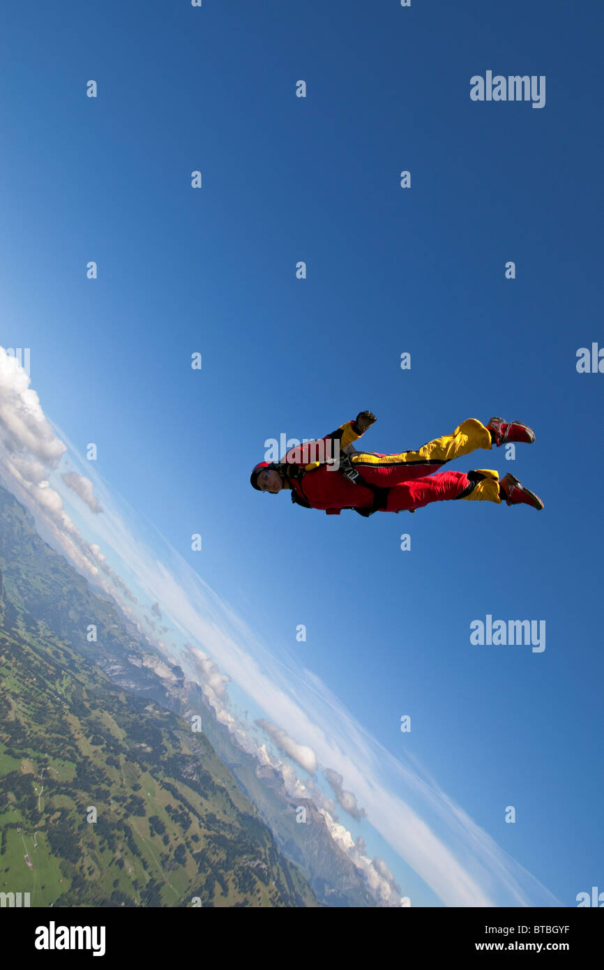 Girl is training the tracking flight position in freefall with 120 MPH ...