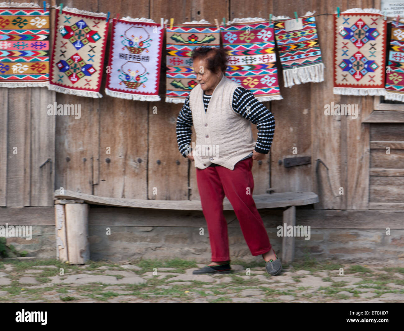 Old lady selling rugs in Zheravna, a traditional Preserved Village in ...