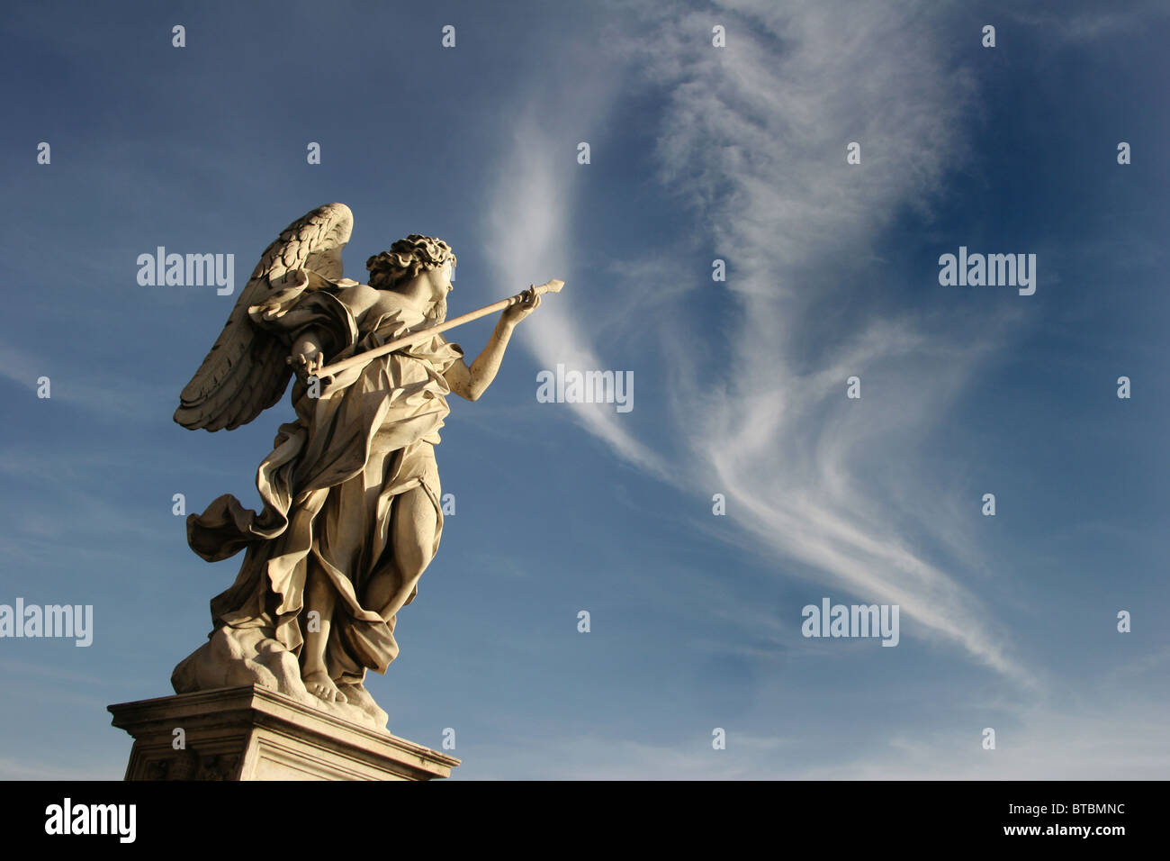 Bernini's marble statue of angel against the background of sky on Sant ...