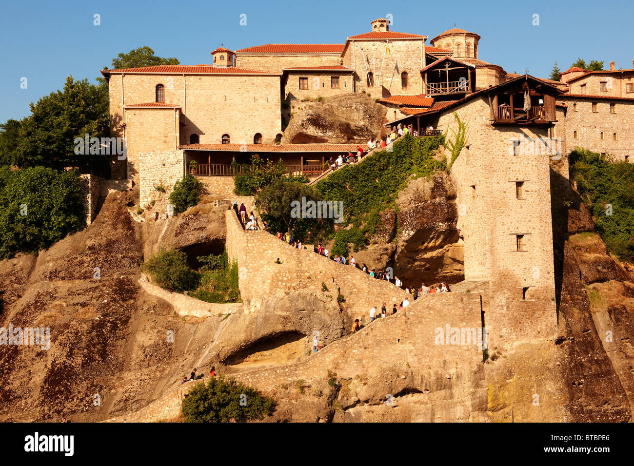 Pilgrims walking up the steps to The Monastery of Great Meteoron ...