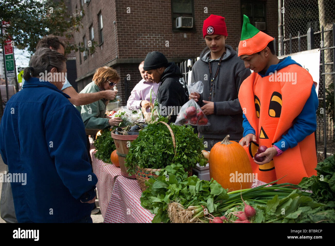 Customers stock up on fresh fruits and vegetables at the Fulton ...