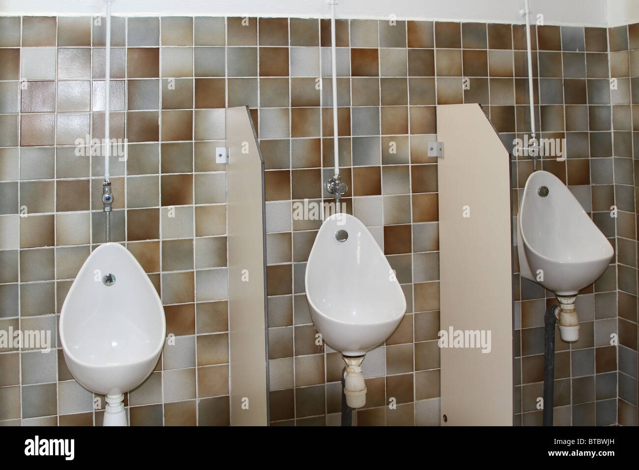 Row urinals in public toilet hi-res stock photography and images - Alamy