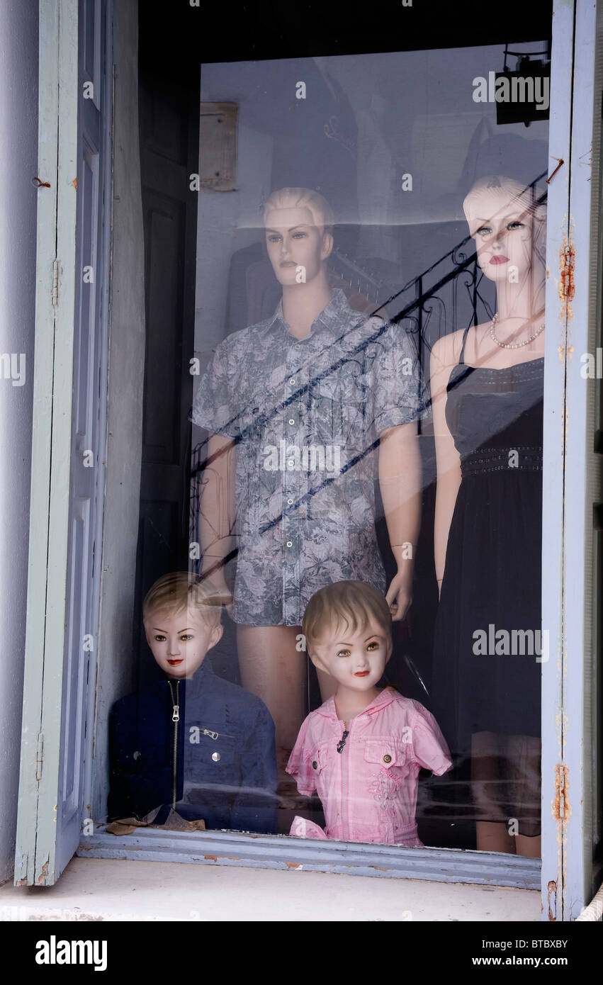 Family of creepy looking showroom dummies in a store window Stock Photo ...
