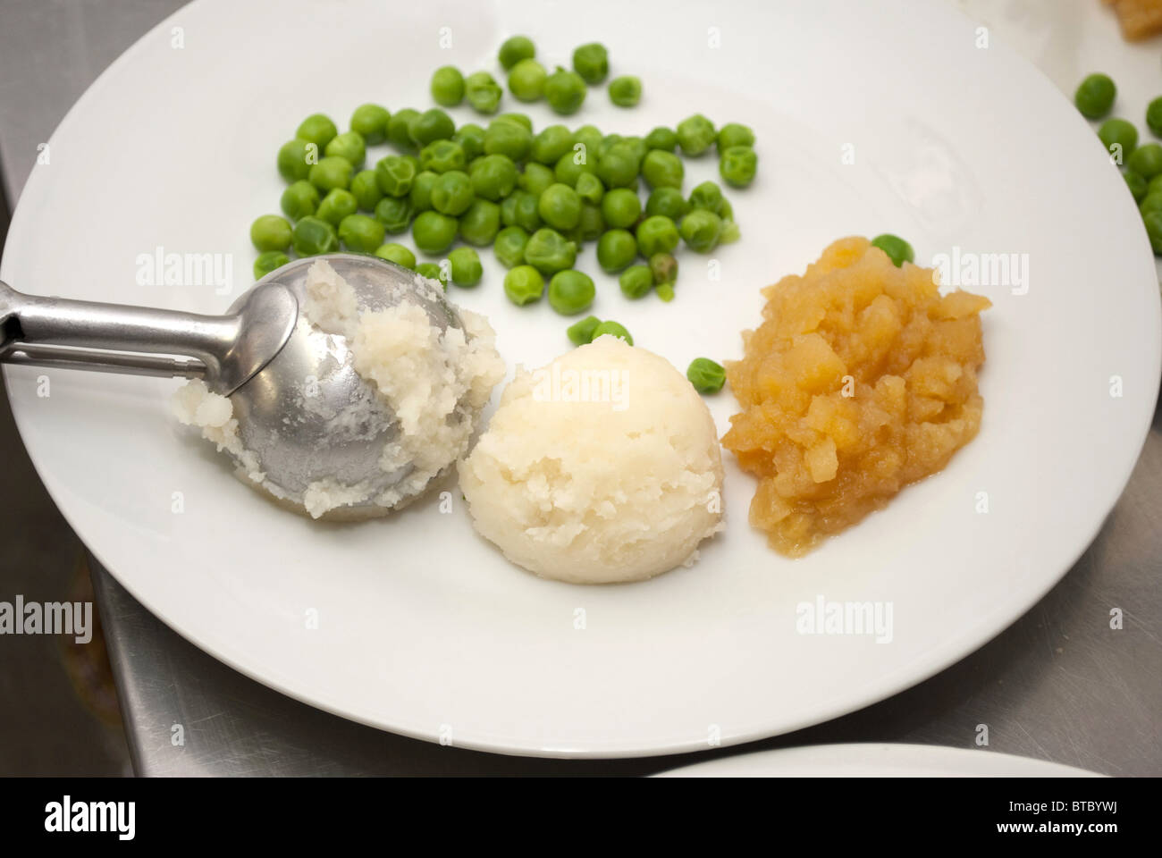 plate used in a large kitchen canteen Stock Photo - Alamy