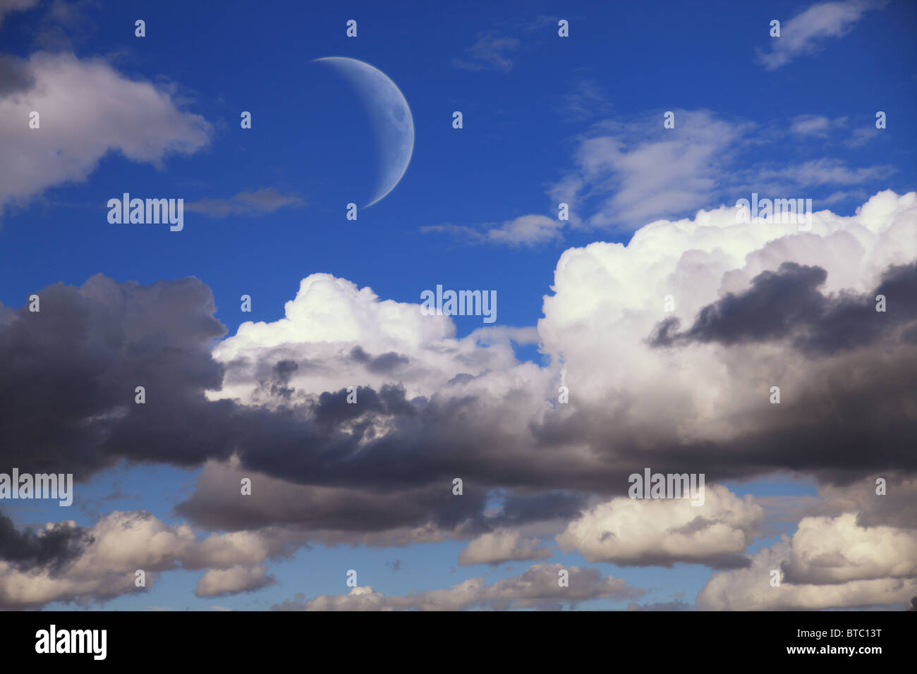 big moon in the daytime sky with clouds Stock Photo - Alamy