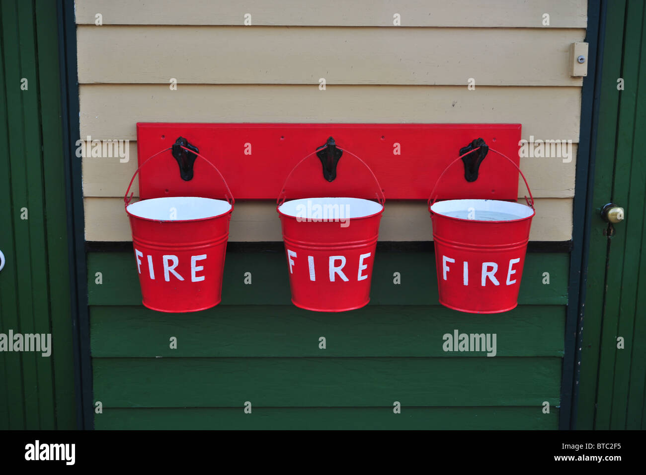 Red fire buckets at Pickering Station Stock Photo - Alamy