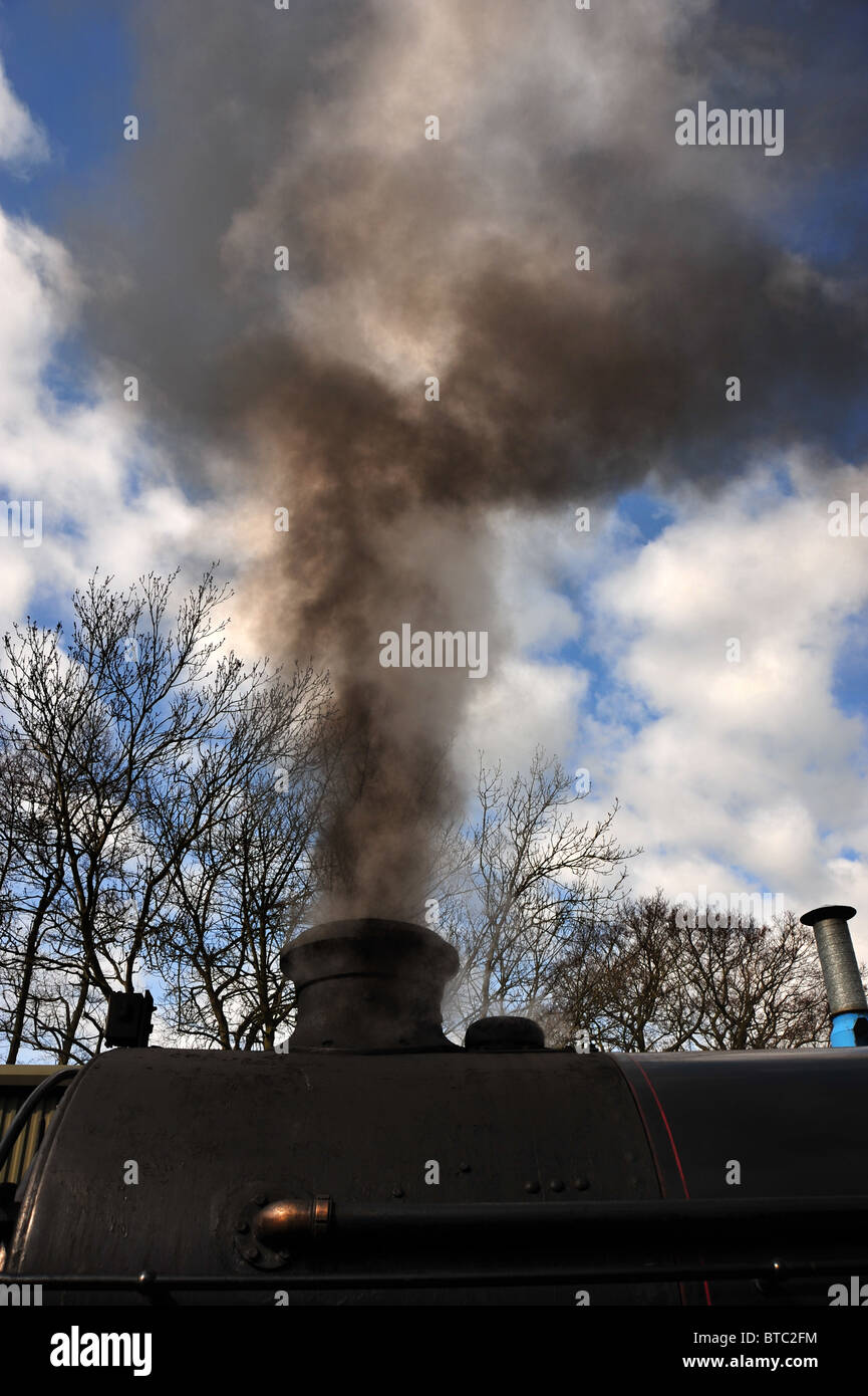 Steam engine blowing smoke Stock Photo - Alamy