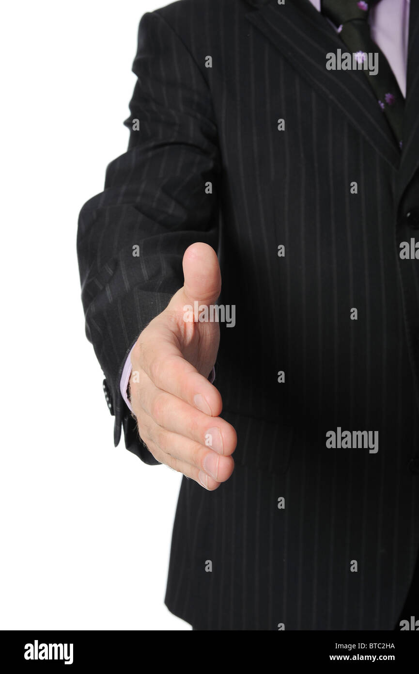 Businessman in a suit holds out his hand for a handshake Stock Photo ...