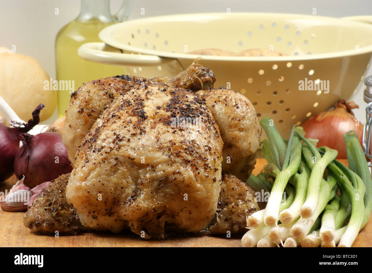 one grilled chicken with some organic vegetable Stock Photo - Alamy
